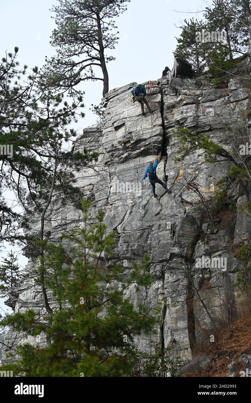 A couple rappels down a cliff face on the Ledge Spring Trail at Pilot ...