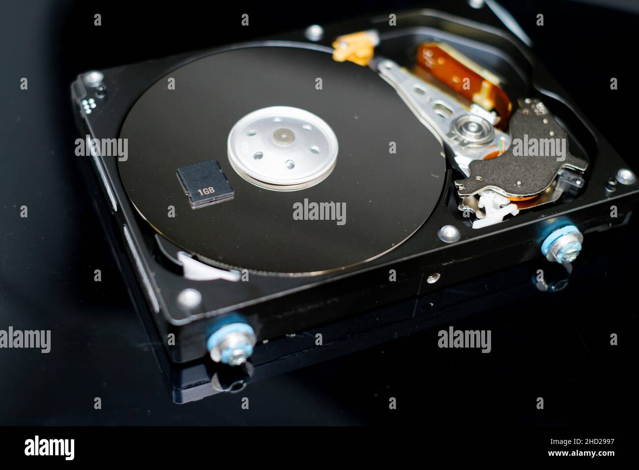 a mini-SD card is on an open hard disk drive Stock Photo - Alamy