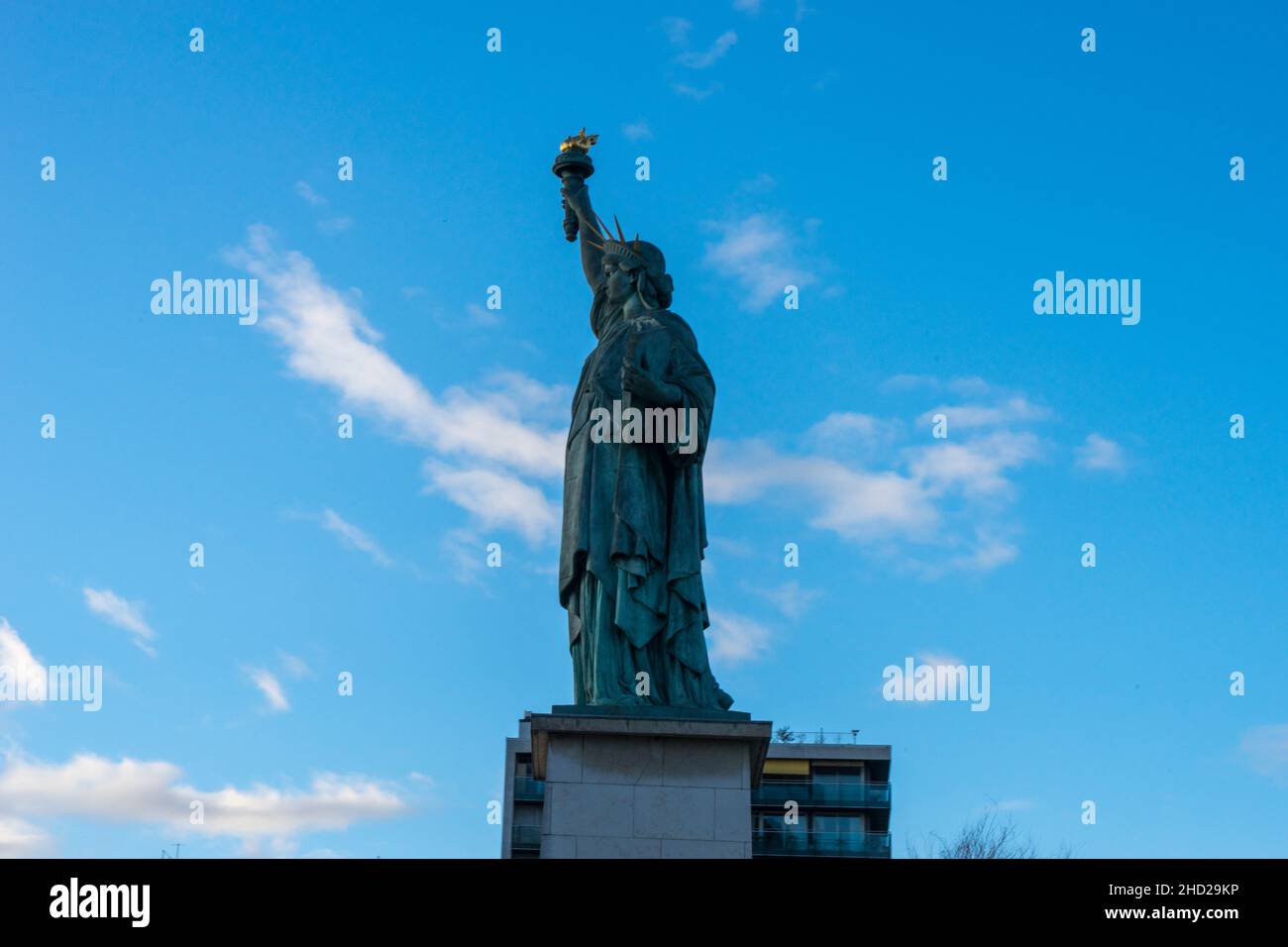 Historic Statue of Liberty on a bright blue sky background Stock Photo ...