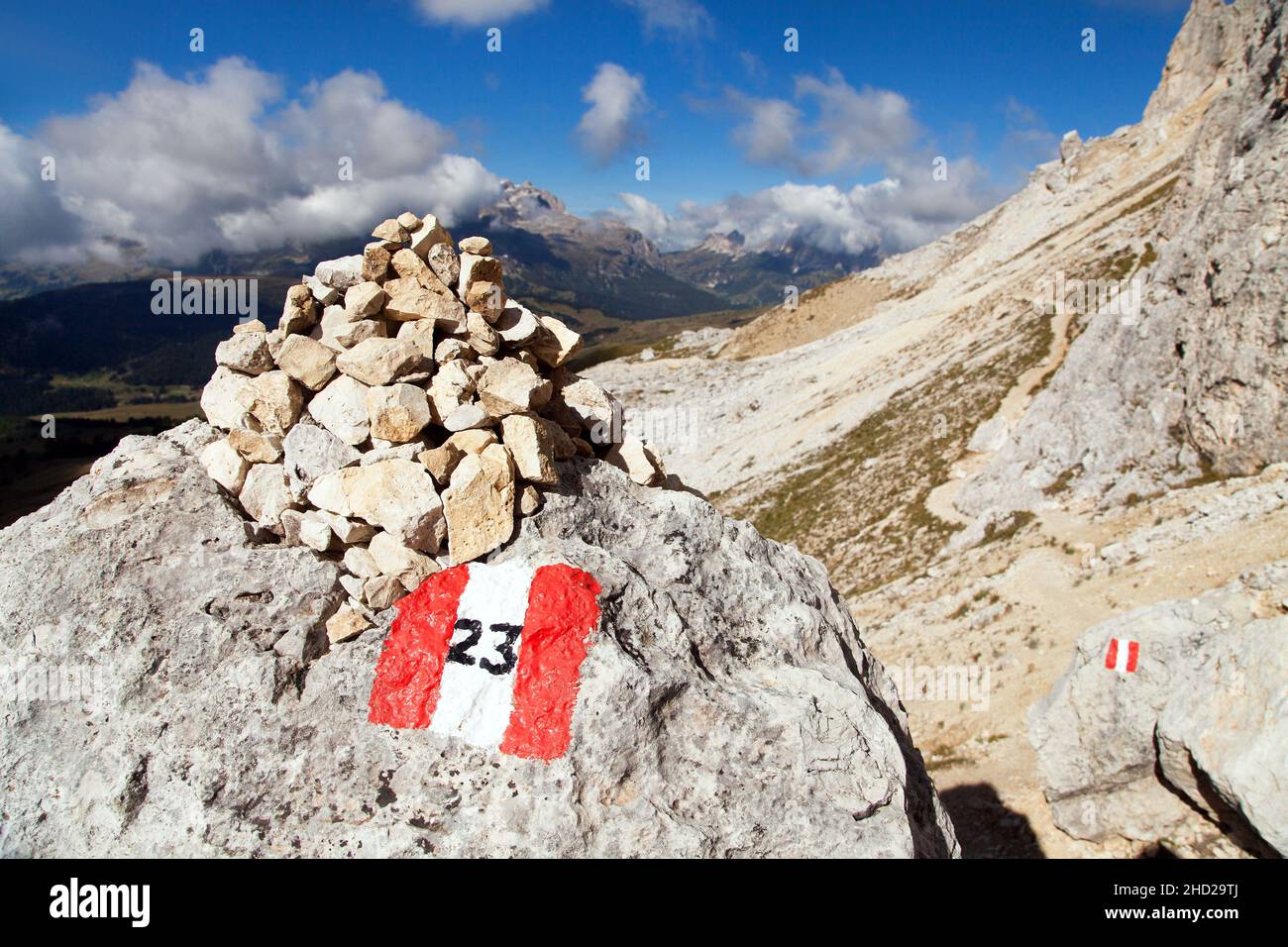 Tourist sign and stone pyramid in Dolomites alps mountains, Italy Stock ...