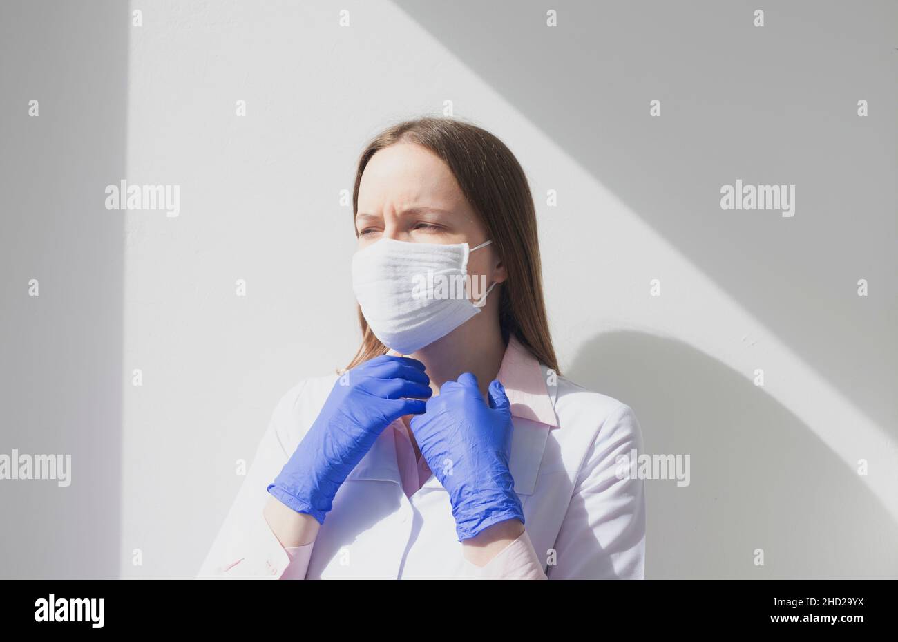 Sad Tired Female Doctor In Blue Medical Gloves In Her Thoughts With