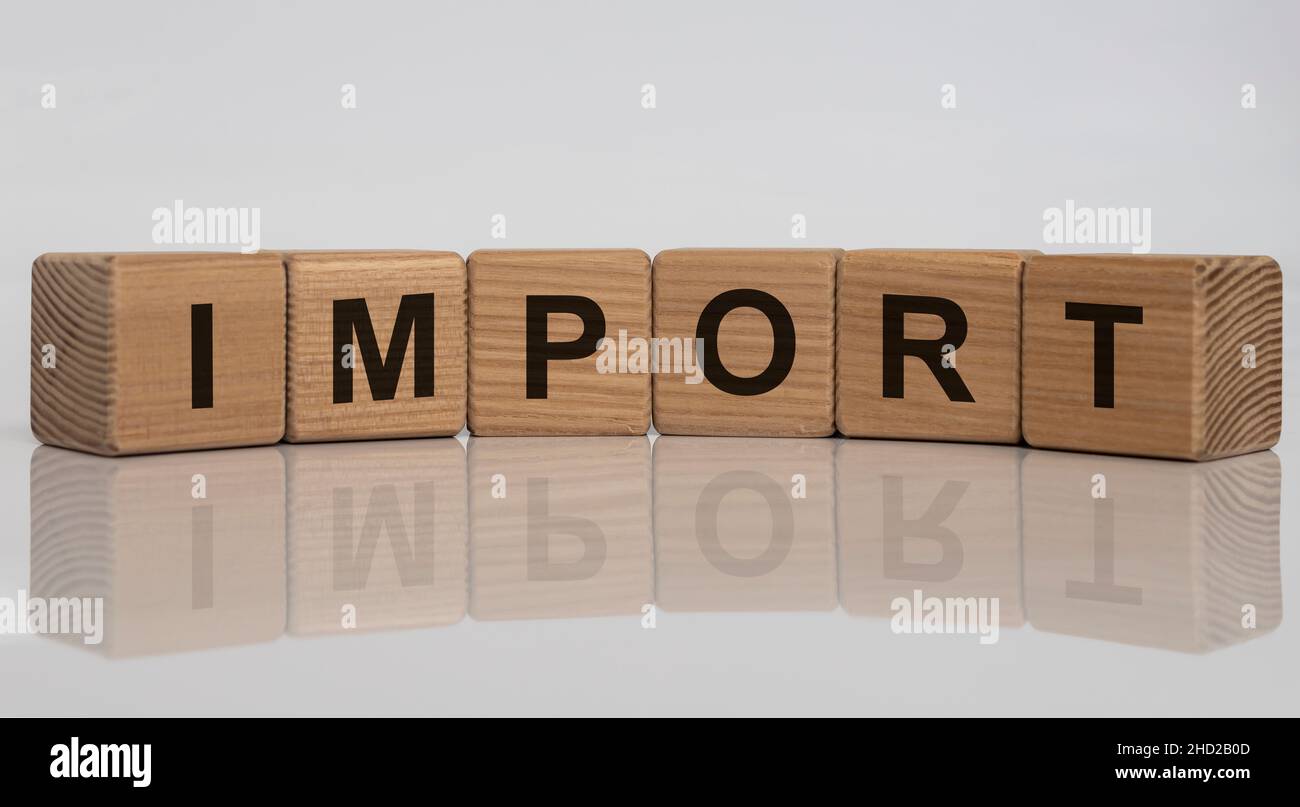 Import Word Written In Wooden Cubes on white glossy background Stock ... Import Word Written In Wooden Cubes on white glossy background Stock ...