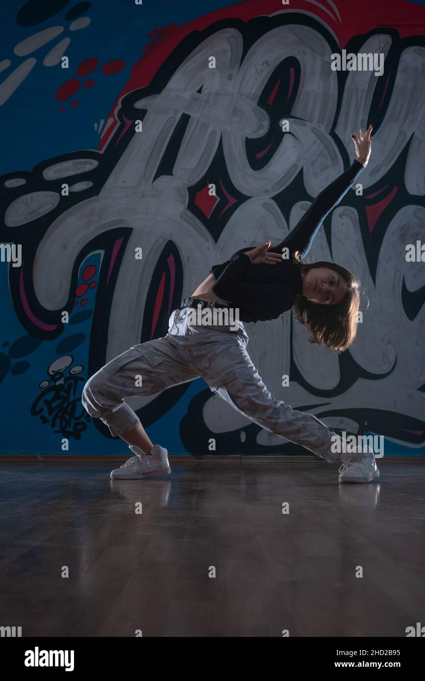 Silhouette of young woman hiphop dancer (breakdancer)dancing on ...