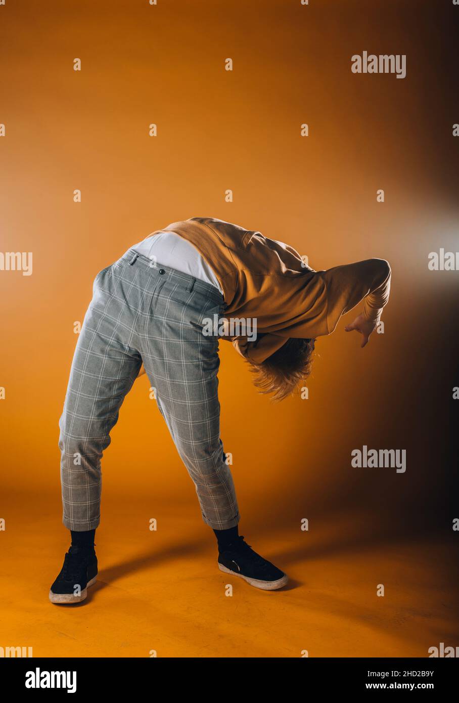 Muscular dance performer practicing dance moves at the studio Stock ...