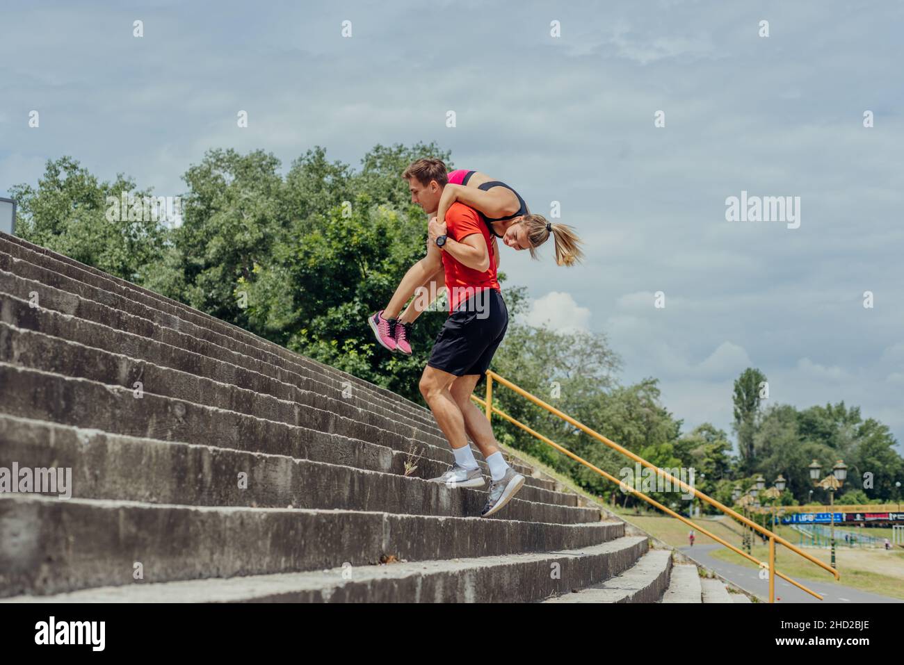 Two friends run up stairs hi-res stock photography and images - Alamy