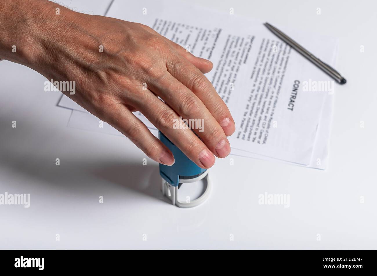 Contract stamping. Businessman or lawyer and rubber stamp Stock Photo ...