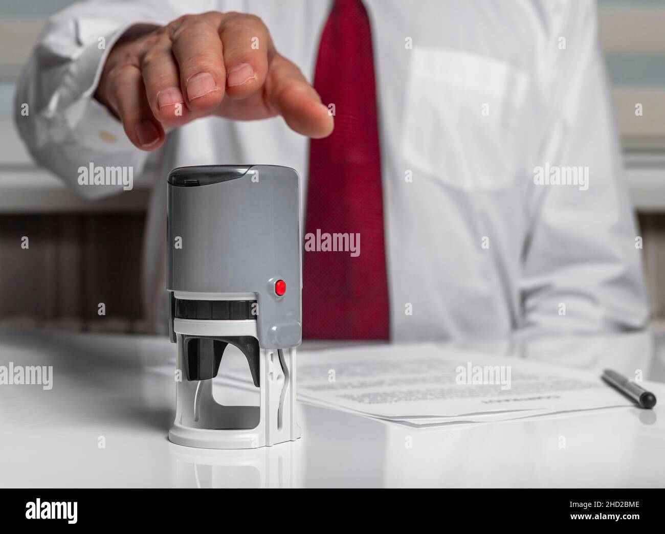 Contract stamping. Businessman or lawyer and rubber stamp Stock Photo ...