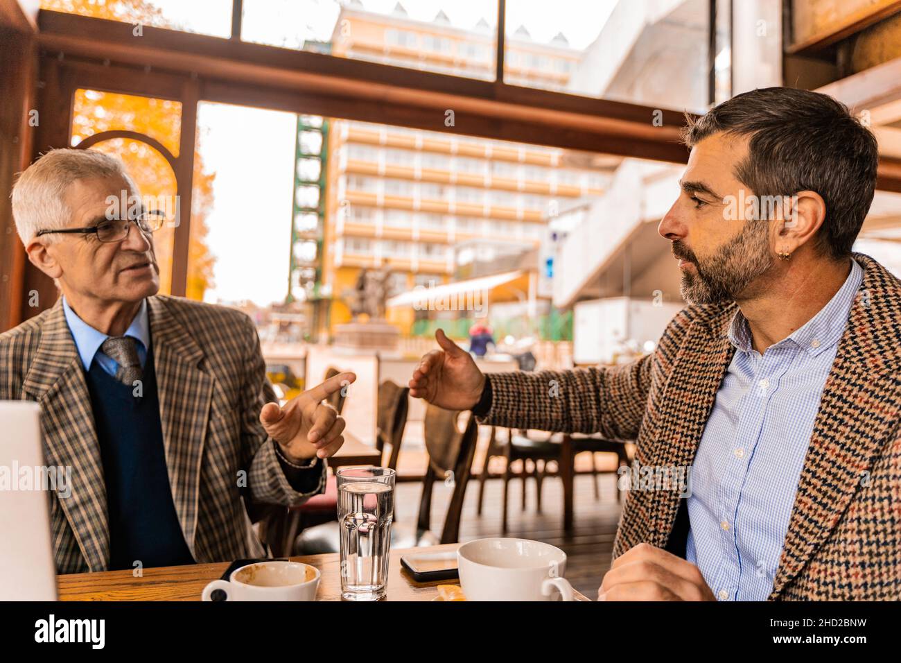 Two senior businessmen are having a serious conversation Stock Photo ...
