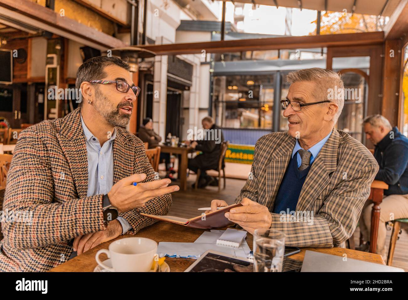Two senior and handsome businessmen are making the new plans Stock ...