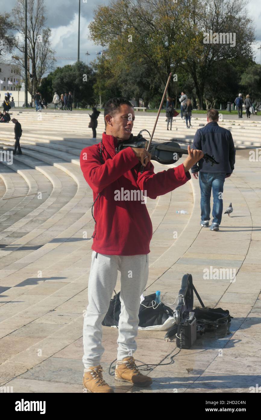 man playing a violin at Belem tower Lisburn Portugal music fiddle steps ...