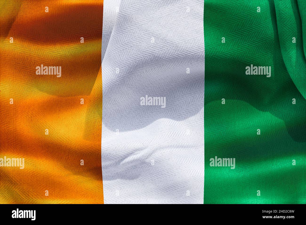A 3D illustration of the realistic waving fabric flag of Ivory Coast ...