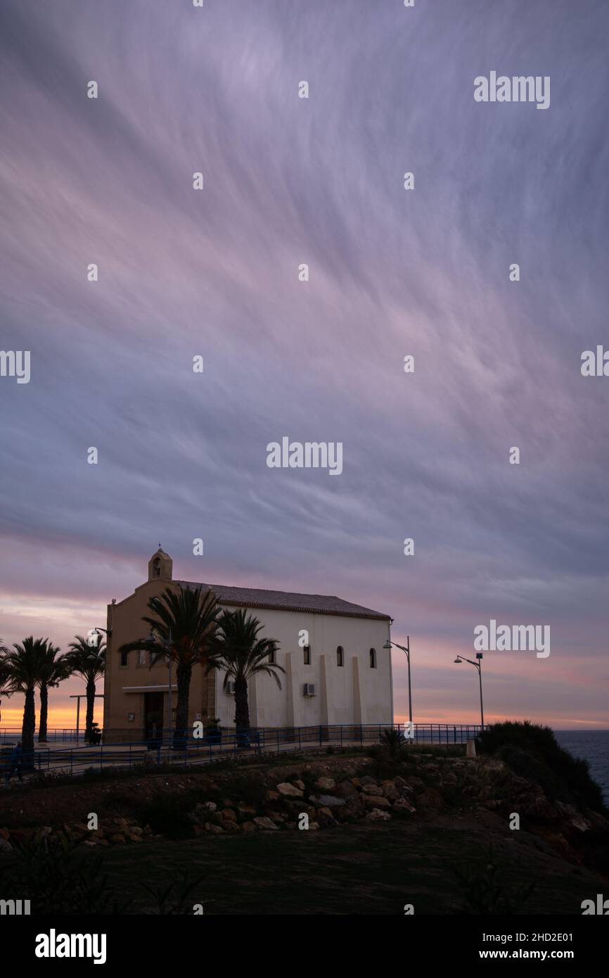 Mediterranean sunrise with illuminated streaky sky . Ermita (Chapel) de ...