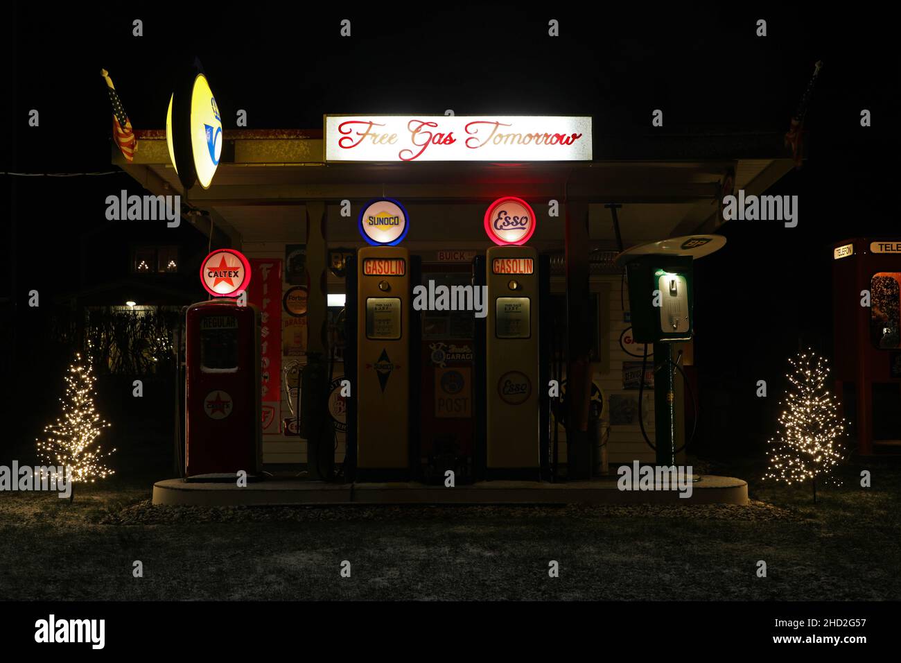 An old recreated gas station. Sign about "Free gas tomorrow Stock Photo ...