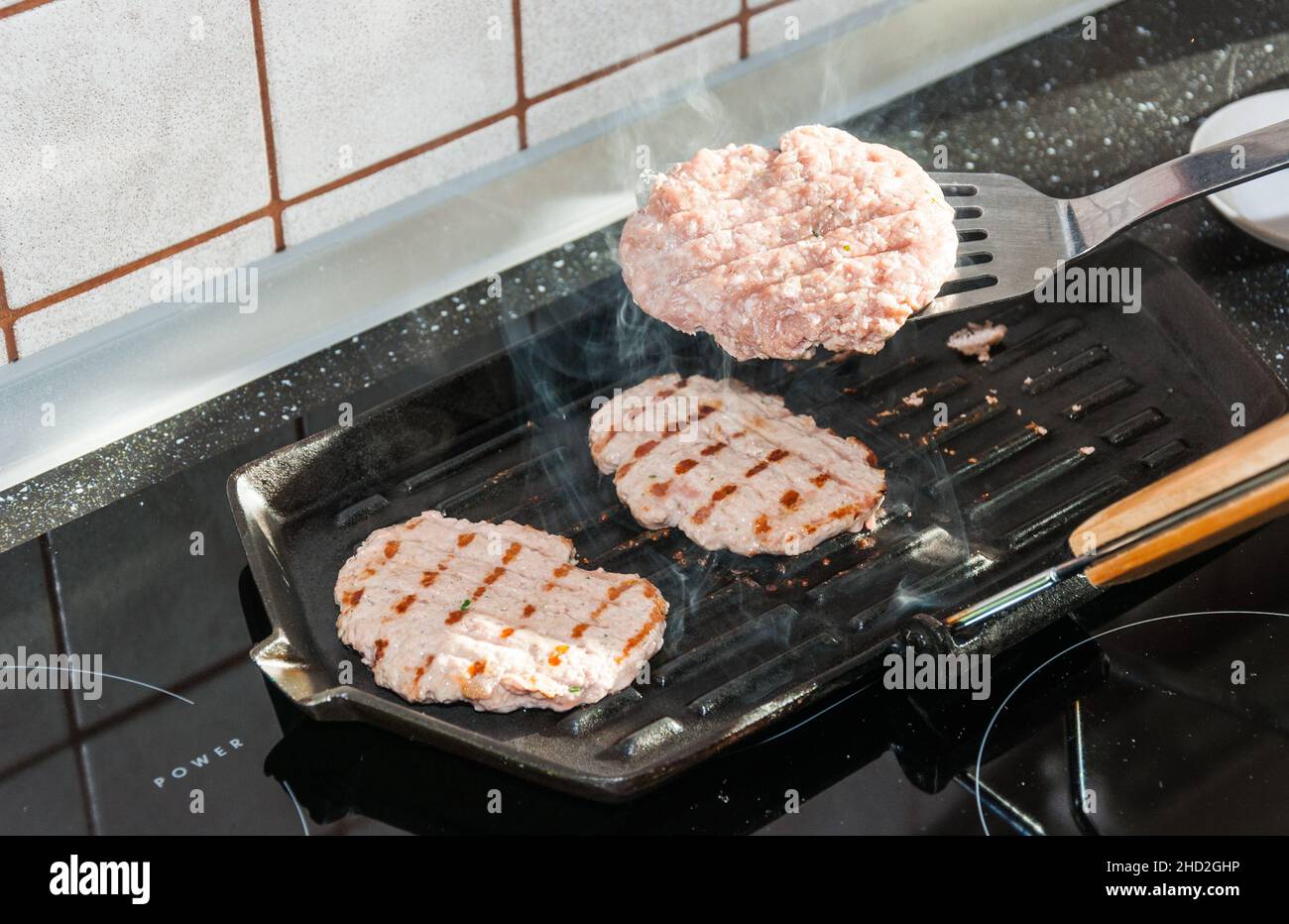Preparation of hamburger hi-res stock photography and images - Alamy