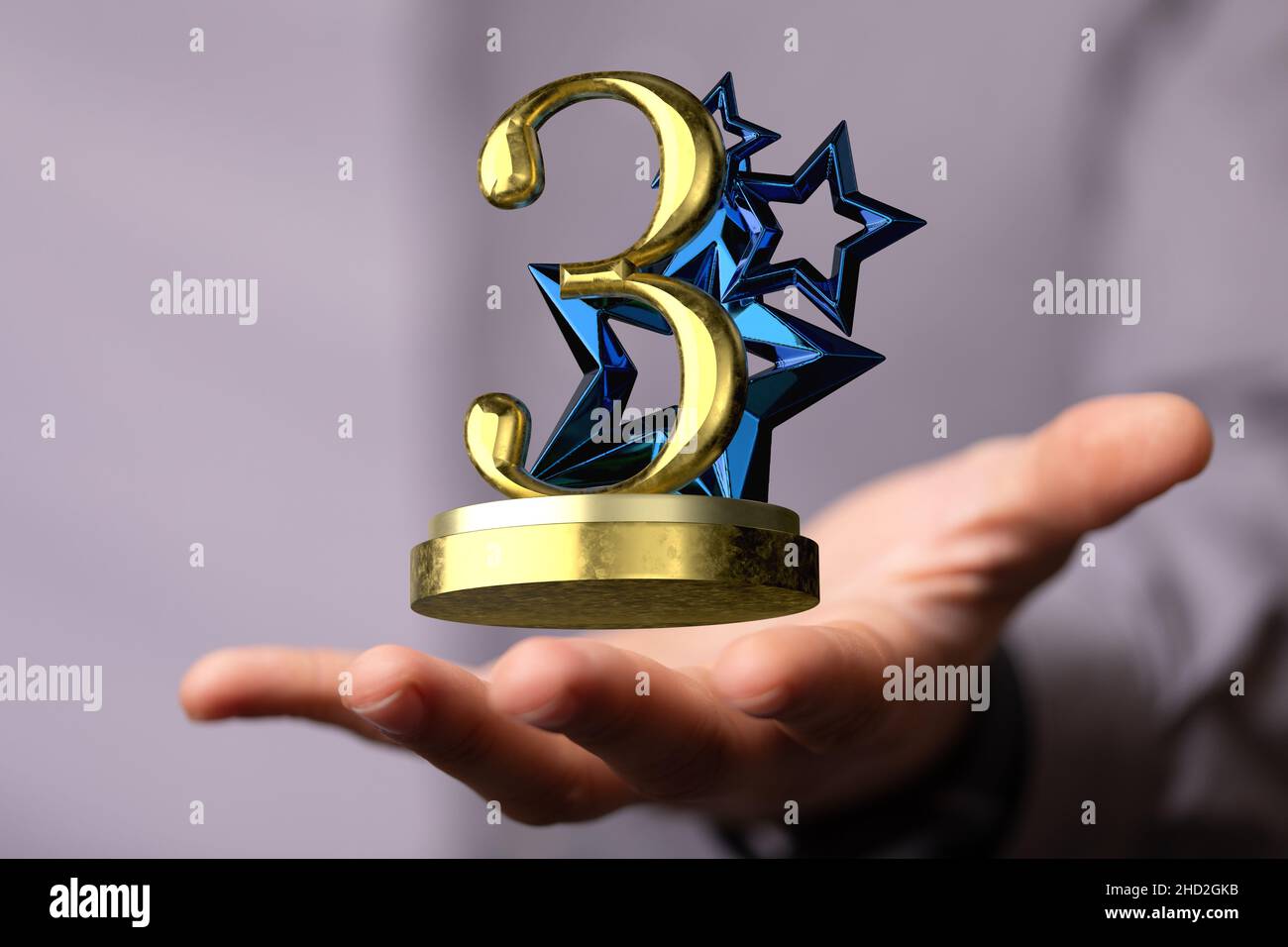 3d rendering of the third-ranked award with a design in a man's hand ...