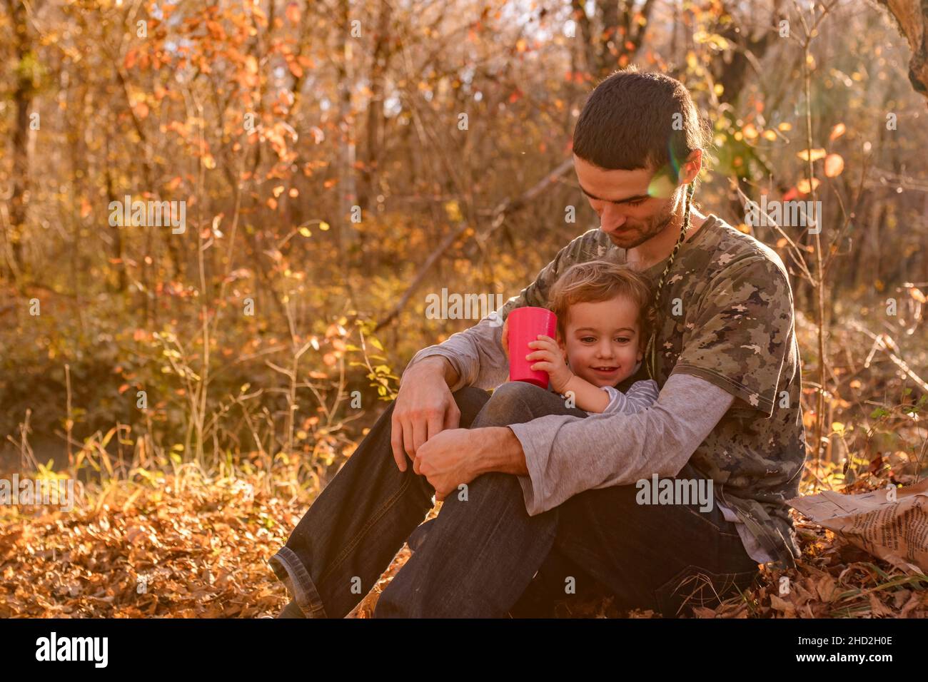 father and son in nature on a sunny warm day have happiness Stock Photo ...