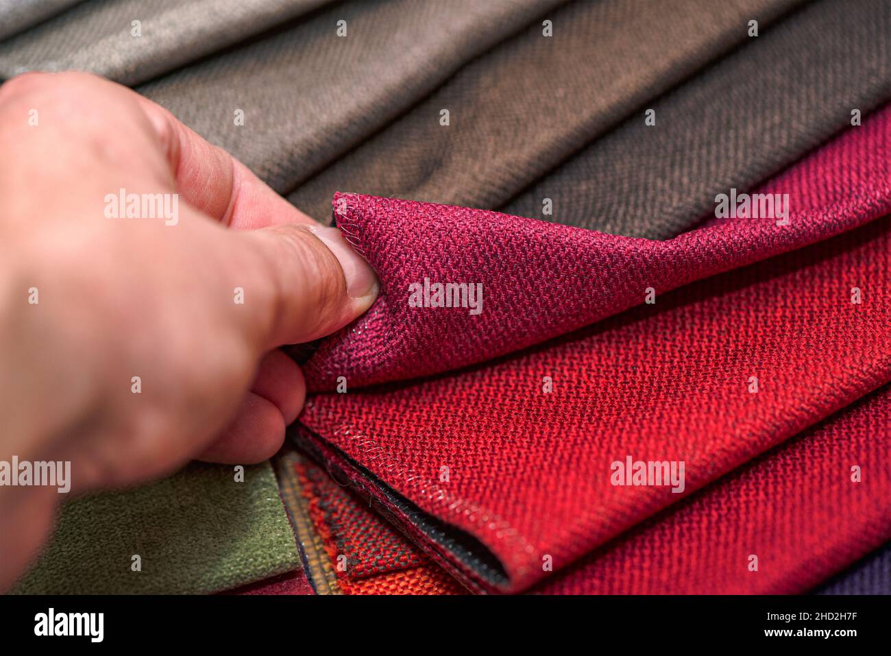 Samples of textiles for upholstery in different colors and thicknesses ...