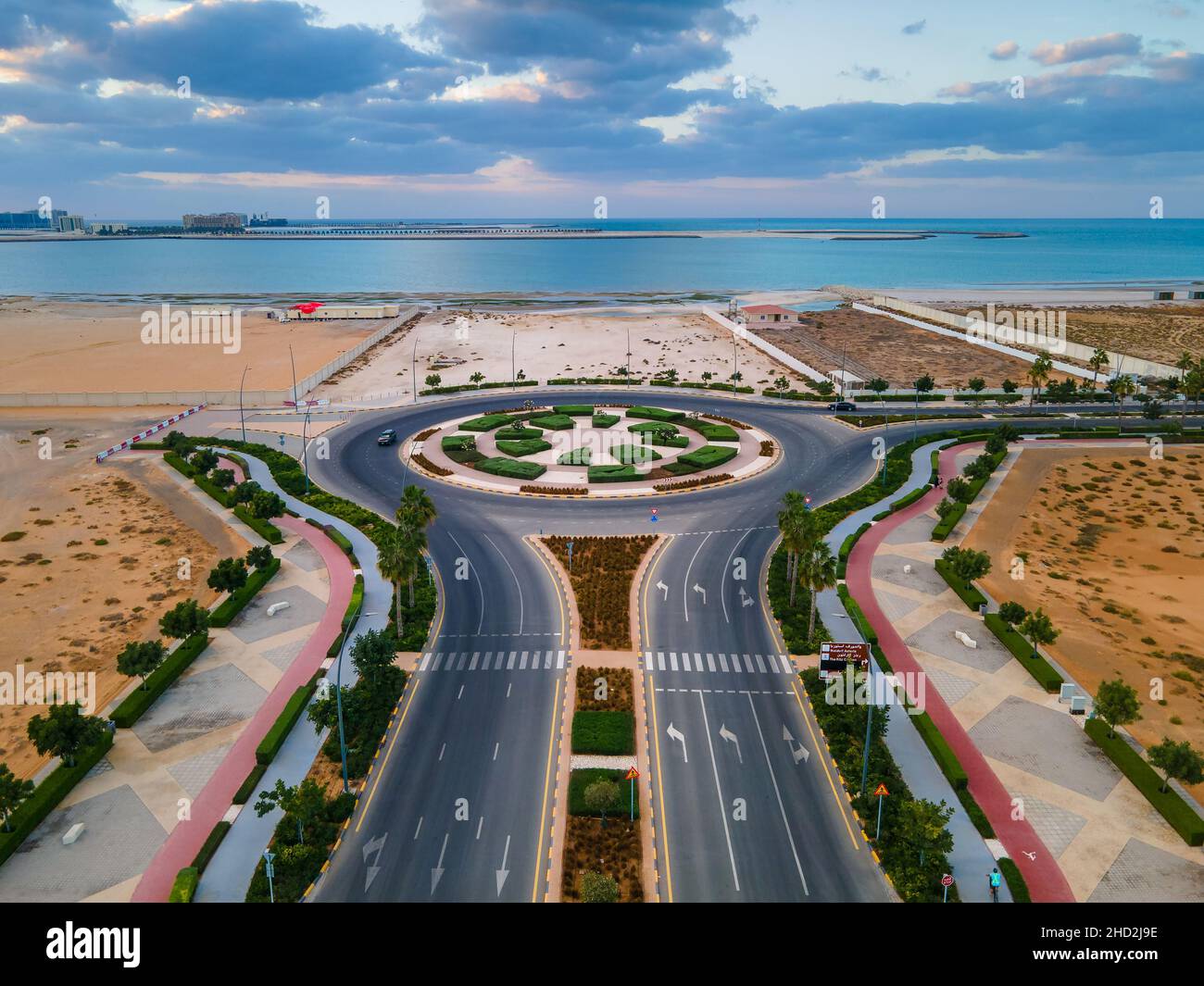 Empty roundabout in a desert by the seaside near Al Hamra village in ...