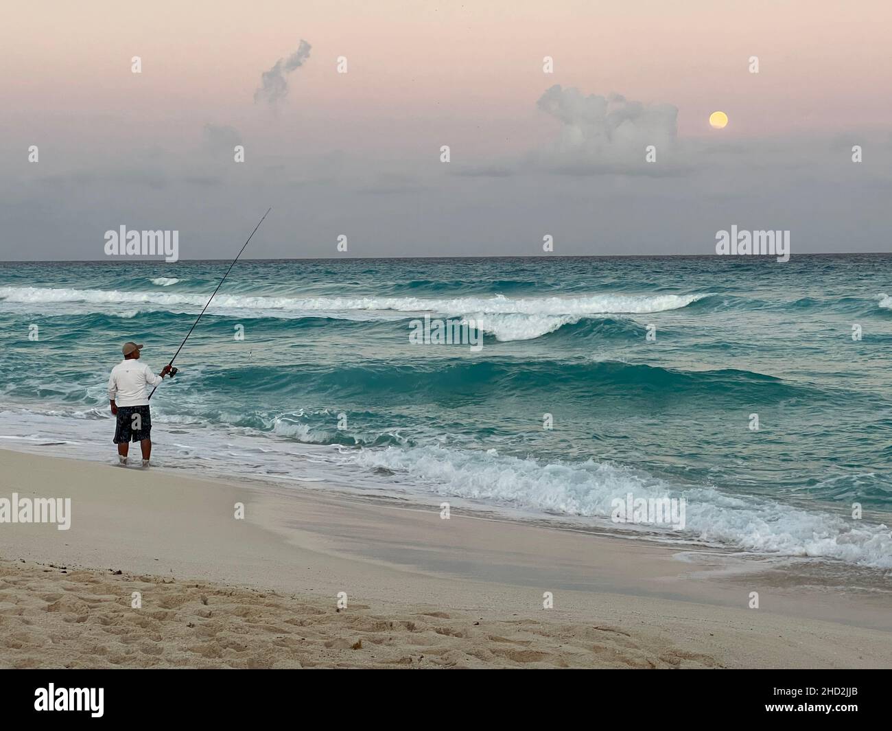 Local fisherman fishing on Cancun beach in Mexico. Fishing at the ...