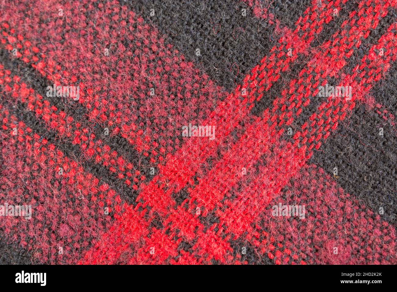 Macro close-up of red check flannel fabric, showing warp and weft ...
