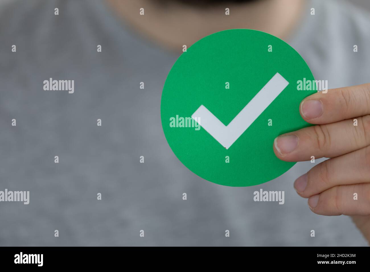 Man showing a tick sign Stock Photo - Alamy
