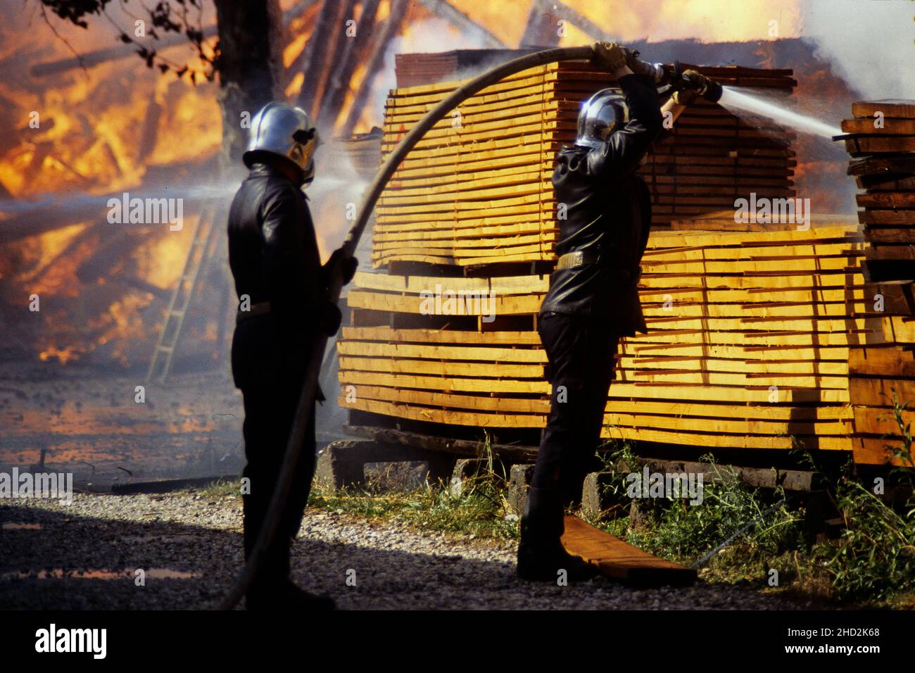 Archives 90ies: Firefighters work to extinguish a big fire in a ...