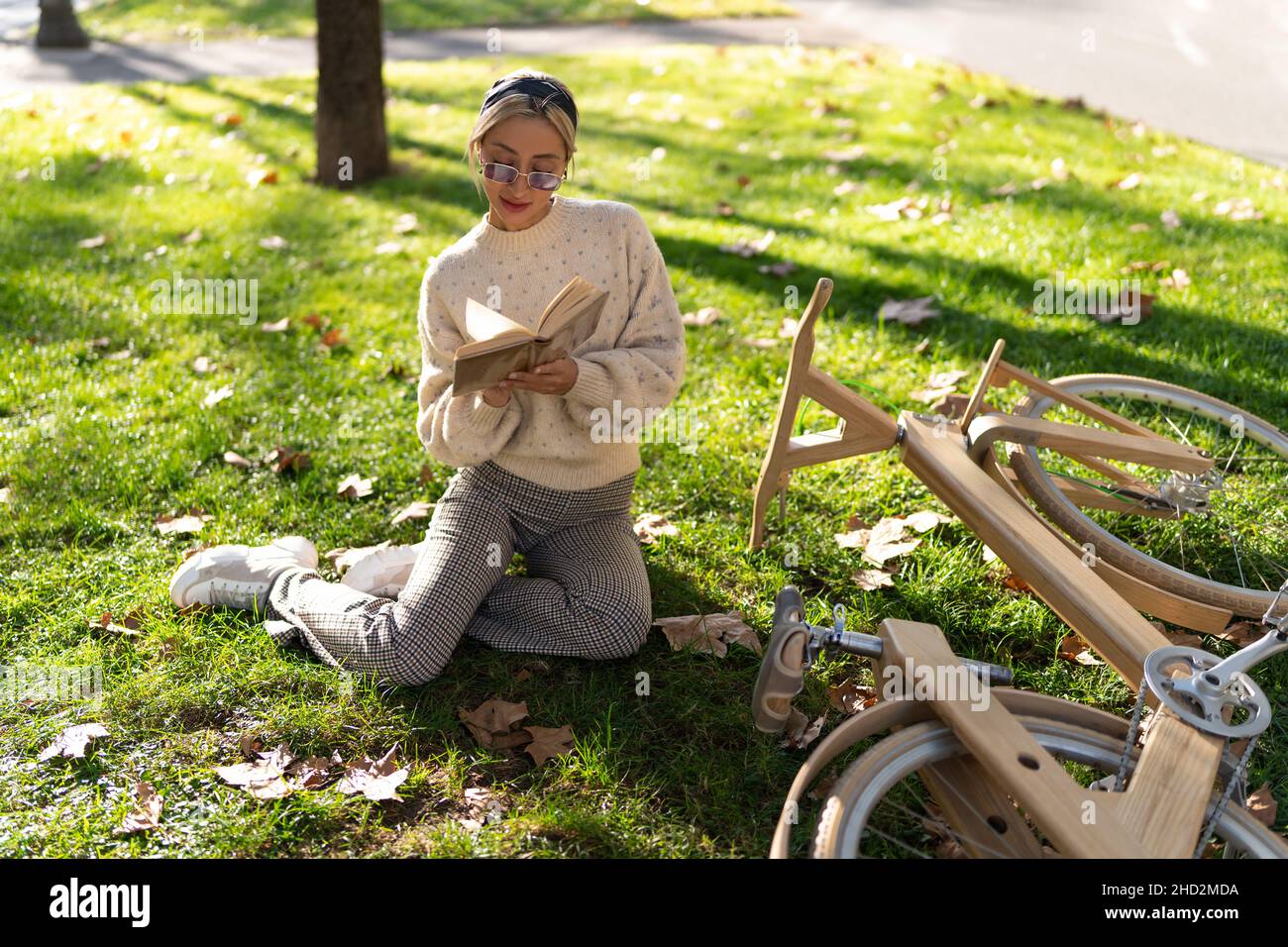 High angle full body of female wearing casual stylish clothes sitting ...