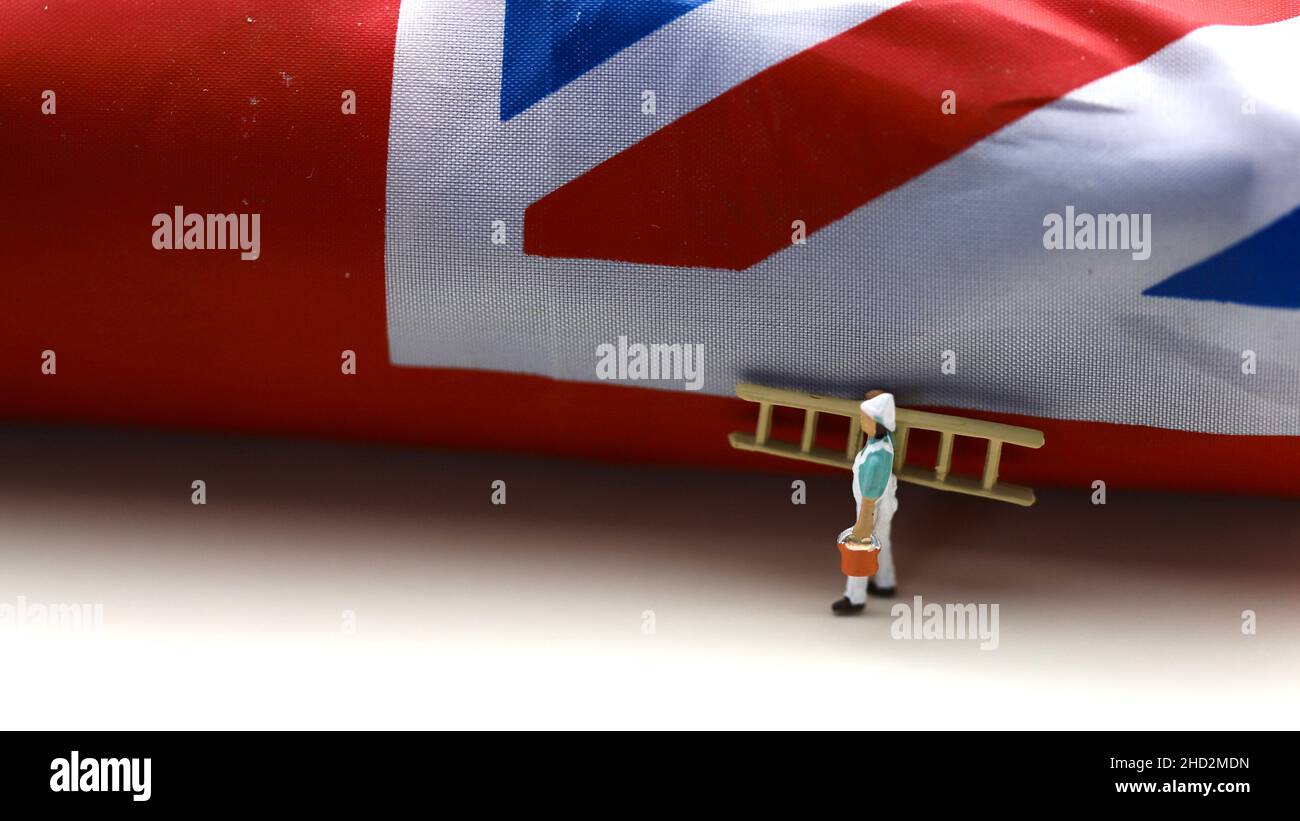 Model British worker cleans and decorates a Union Jack flag Stock Photo ...