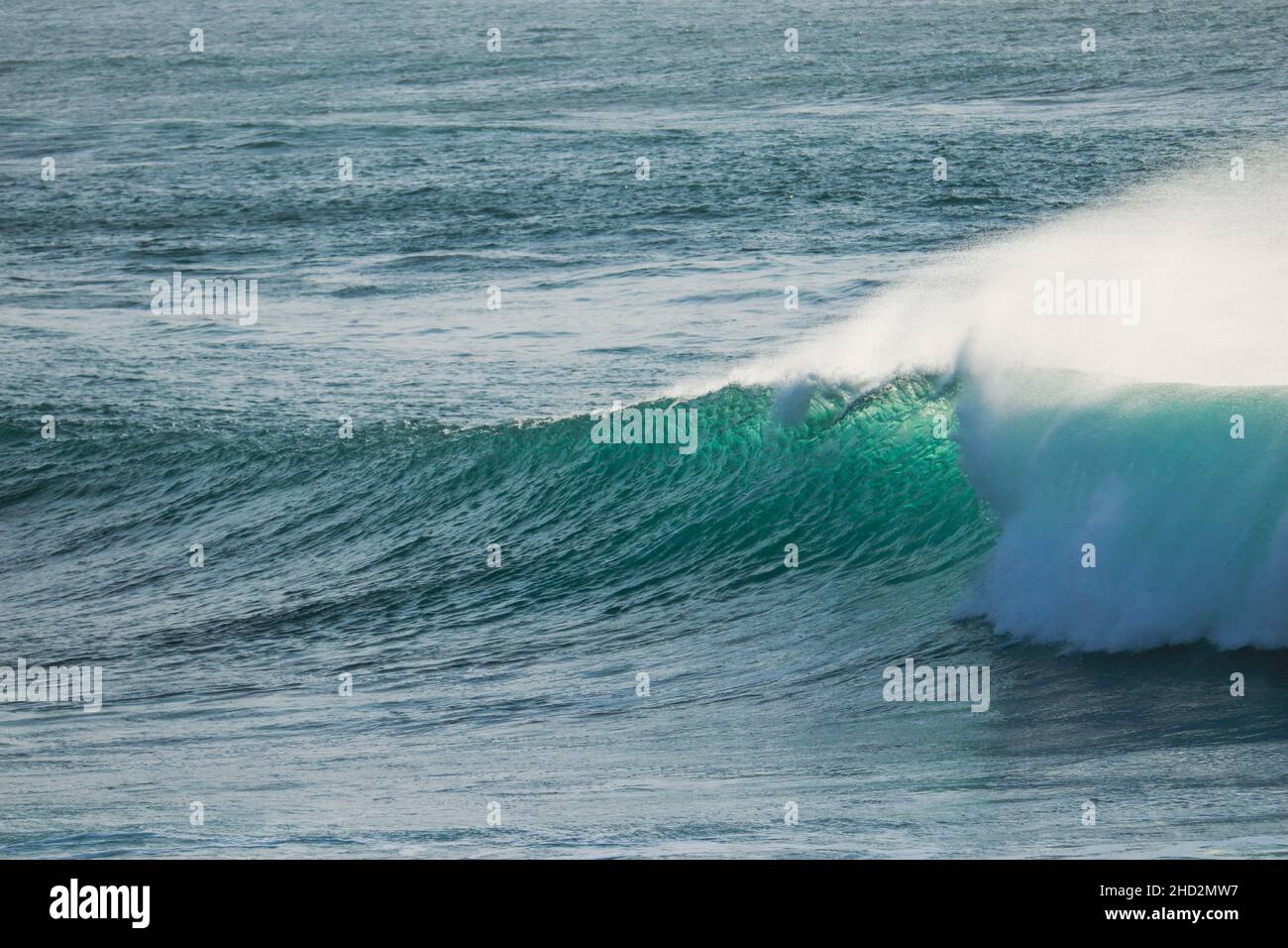Perfect wave breaking in a beach. Surf spot Stock Photo - Alamy