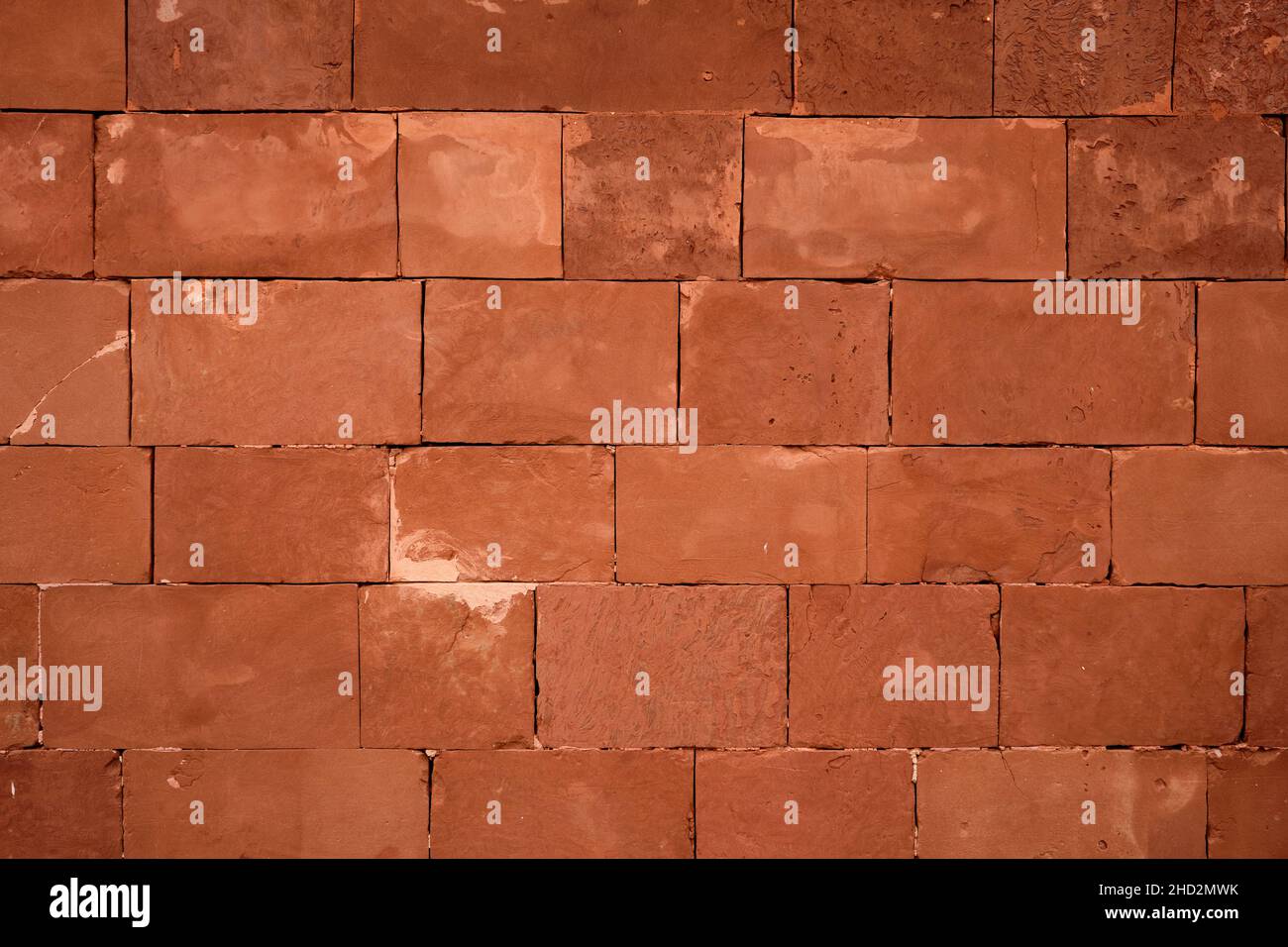 Reddish brown decorative claystone brick wall background Stock Photo ...
