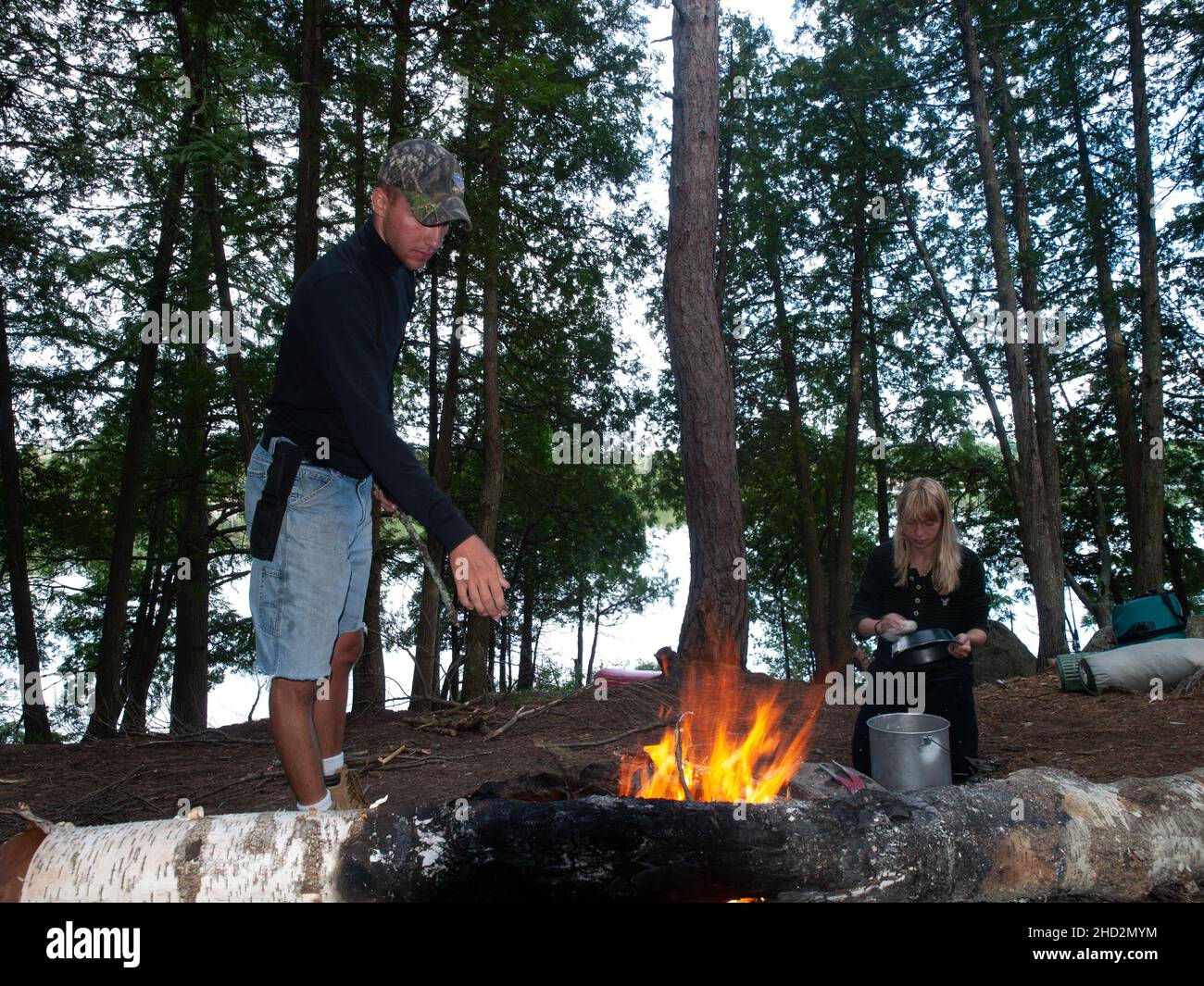 Cooking over campfire Stock Photo - Alamy