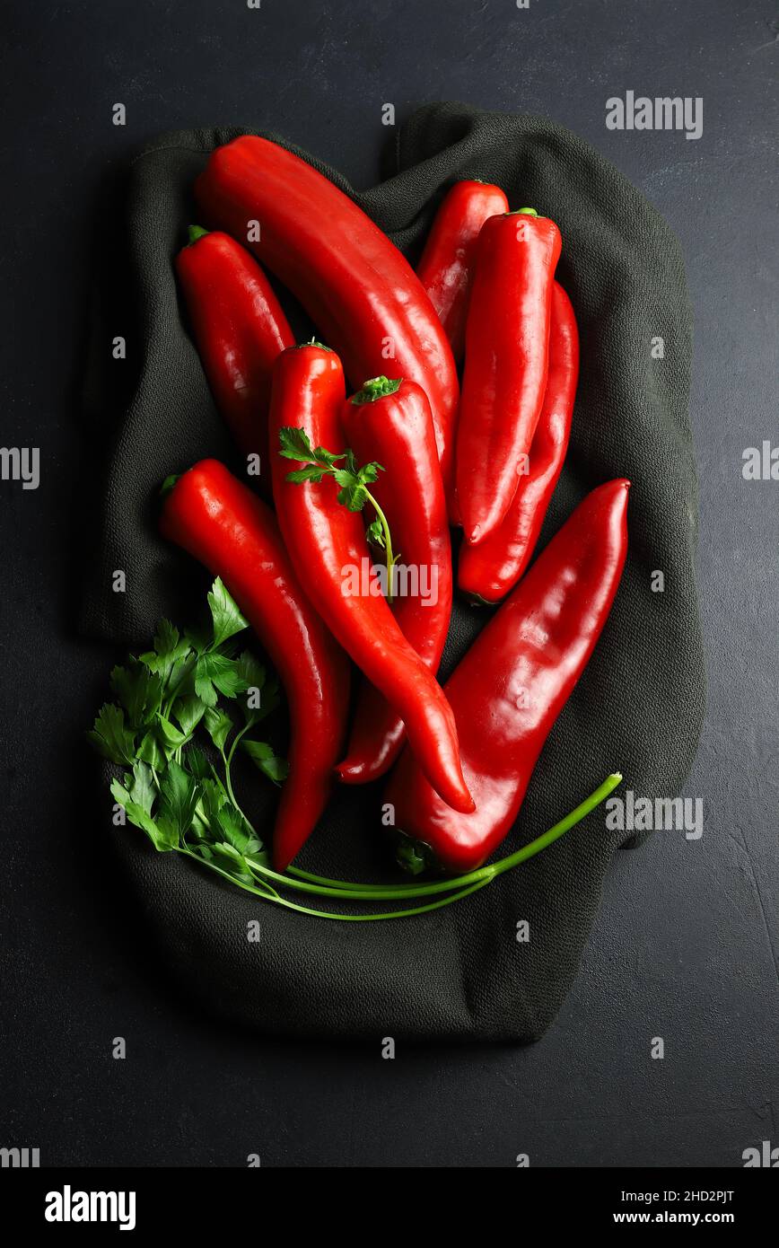 Group of fresh horn peppers on black background. Directly above Stock ...
