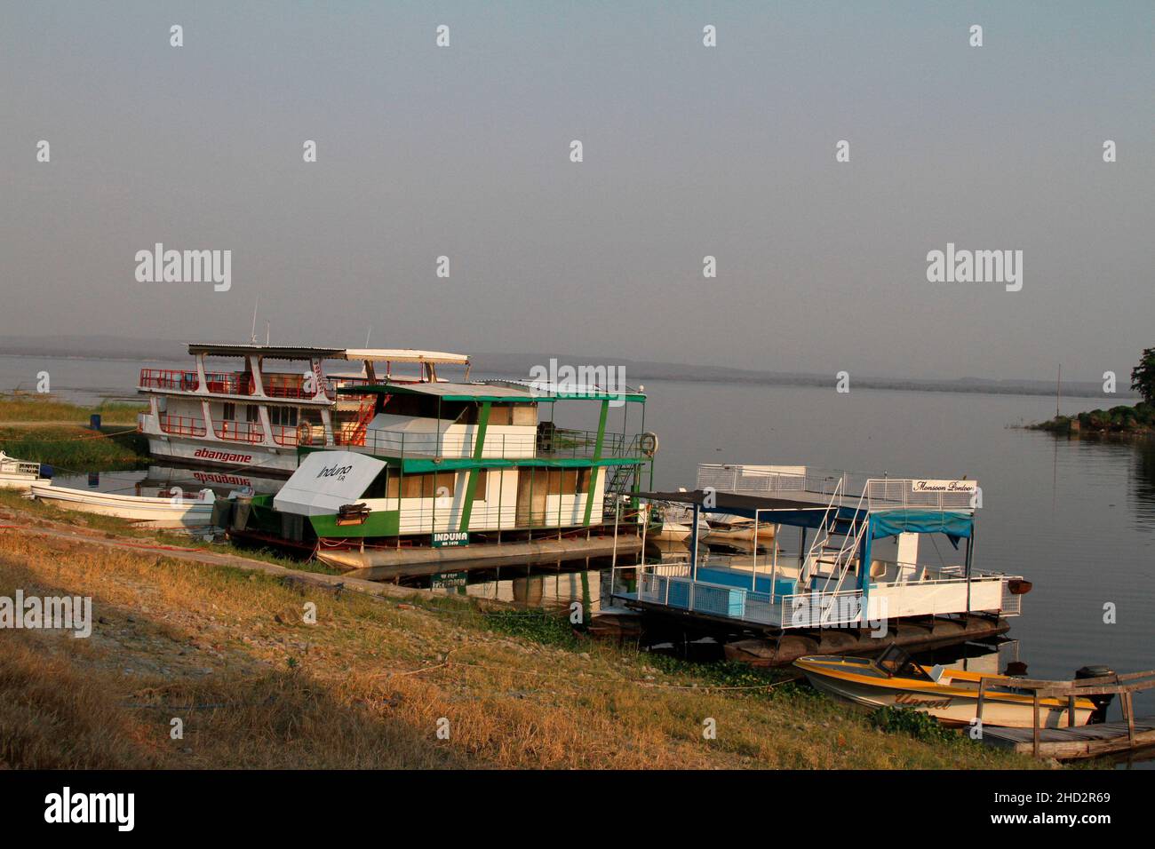 Boats are seen docked on the shores of the Zambezi river in Binga ...