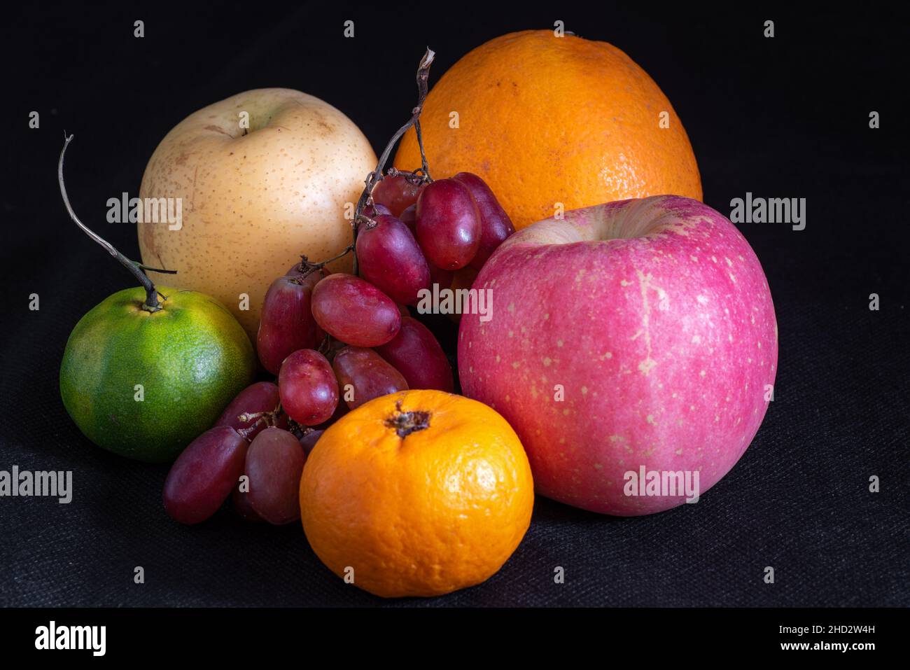 Assorted tropical fruits to welcome the new year Stock Photo - Alamy