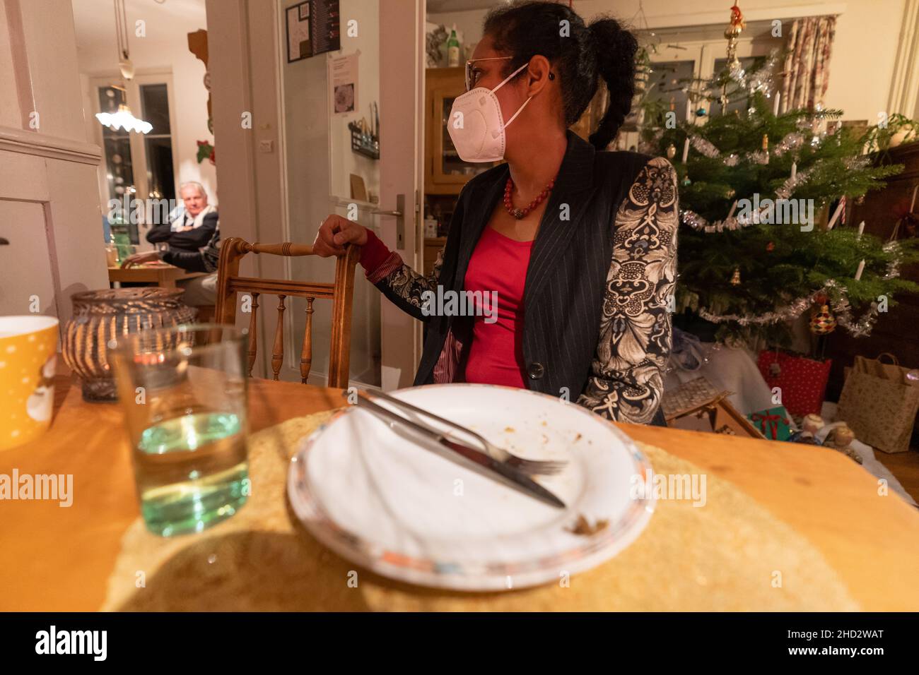 Isolated woman eating with distance at Christmas. Covid-19 theme Stock ...