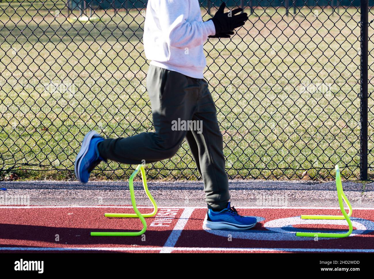 Boy running hurdles hi-res stock photography and images - Alamy