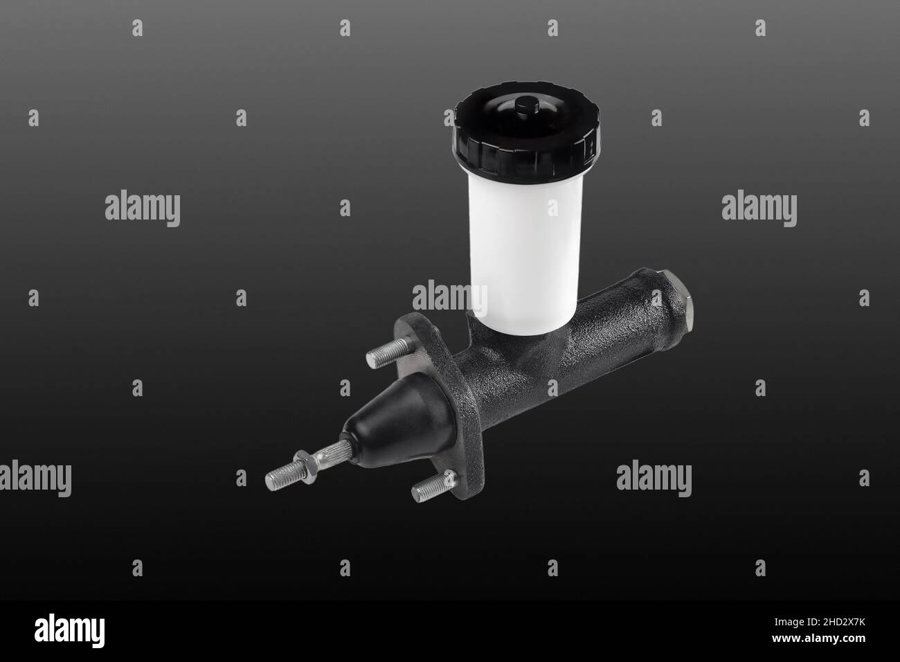 The main brake cylinder of a car with a fluid reservoir and a pusher ...
