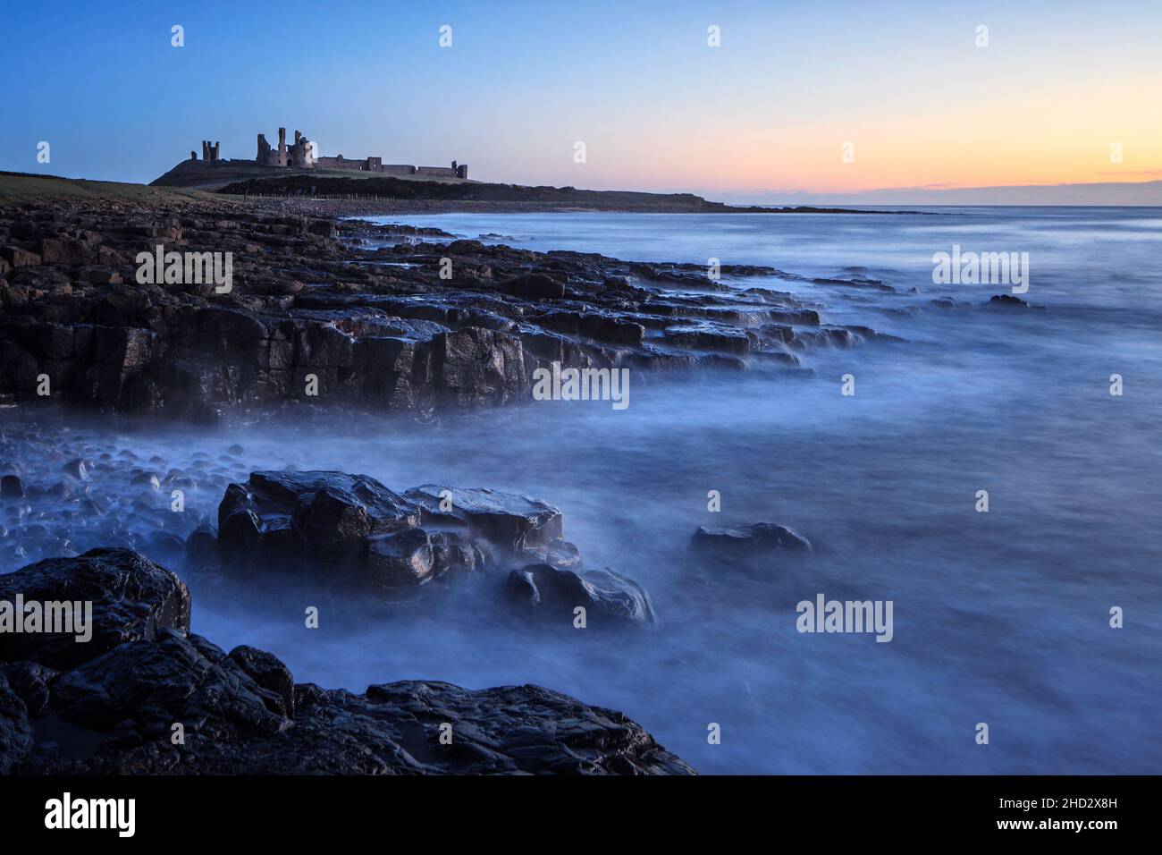 Dunstanburgh castle on the coast of northumberland hi-res stock ...