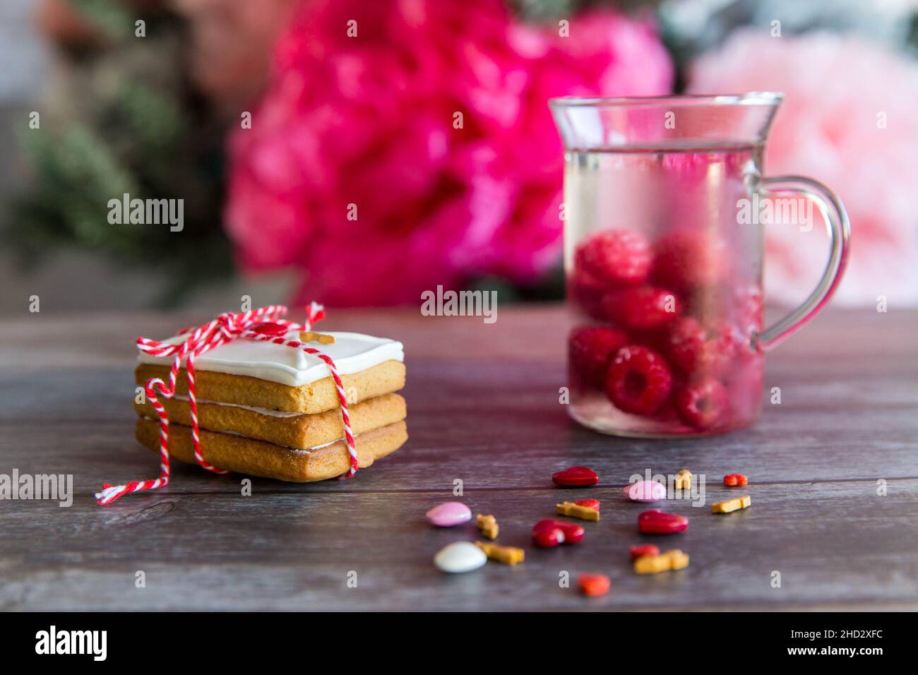 Baking Surprise Cookies with topping and icing on wooden background ...