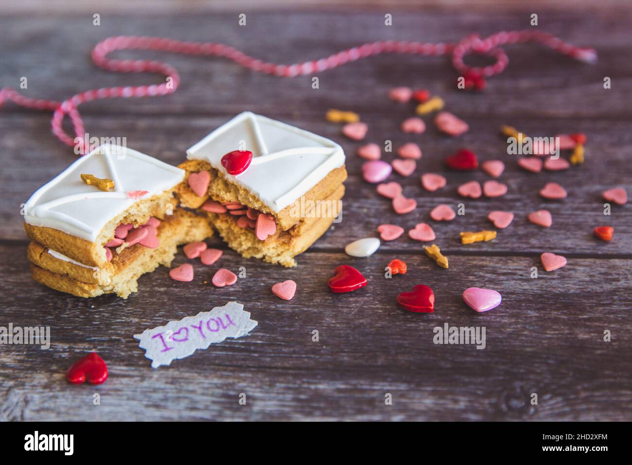 Baking Surprise Cookies with topping and icing on wooden background ...