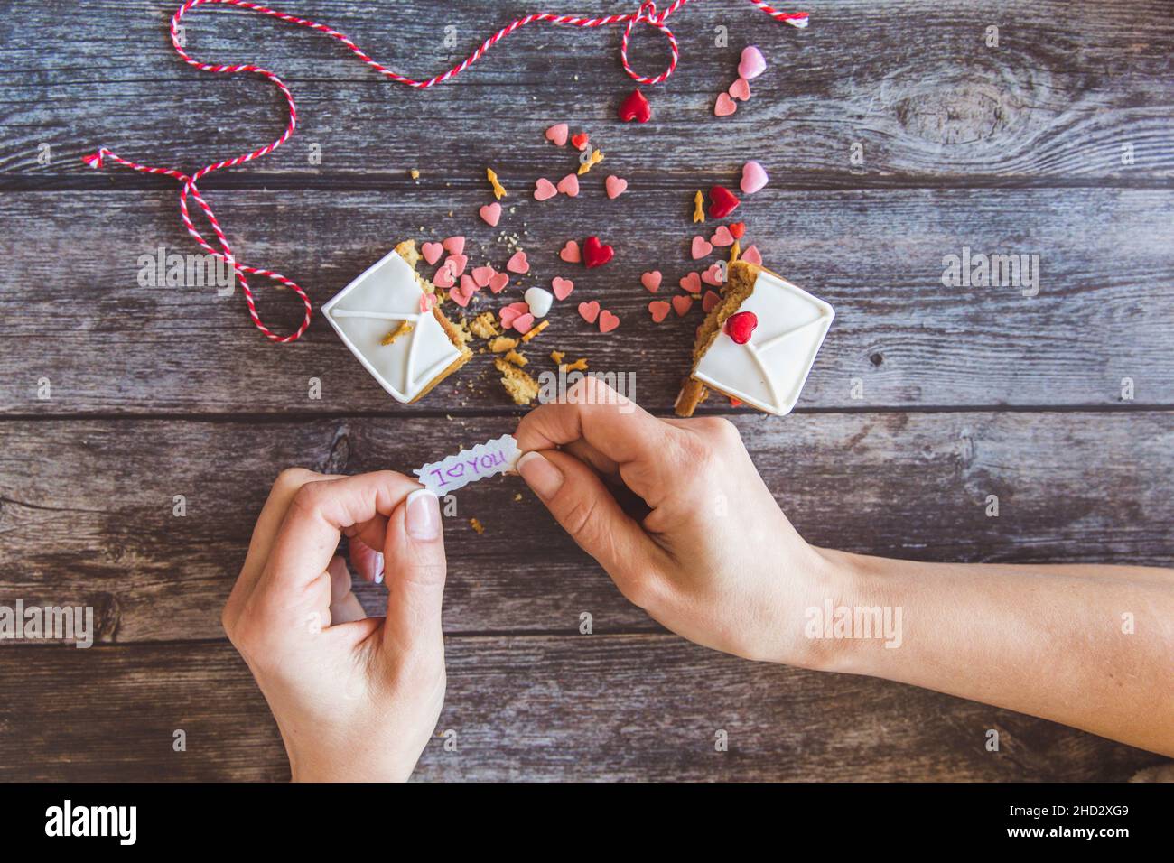 Baking Surprise Cookies with topping and icing on wooden background ...