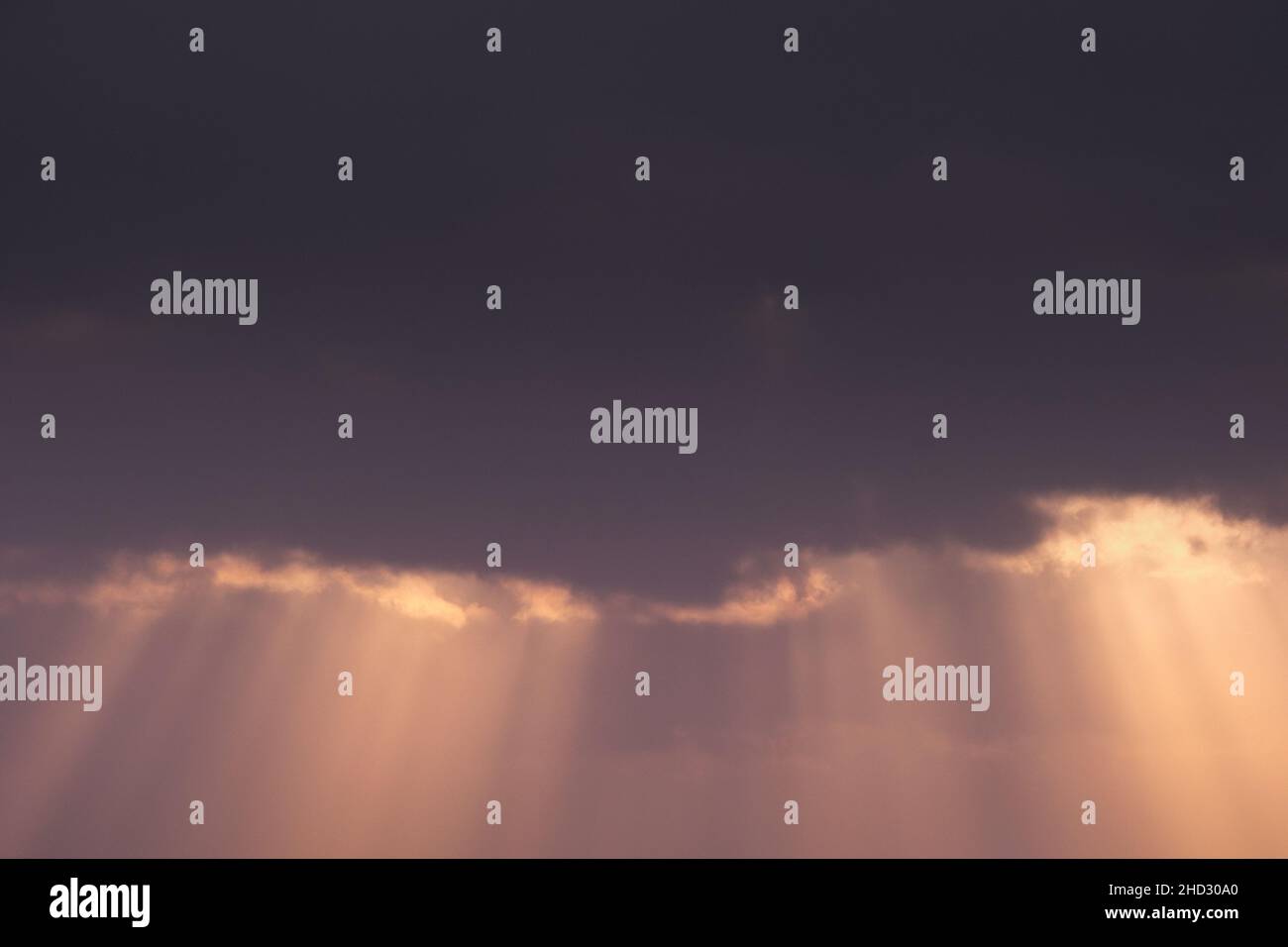 Close up view of dramatic susnet sky with sunrays breaking throught the ...