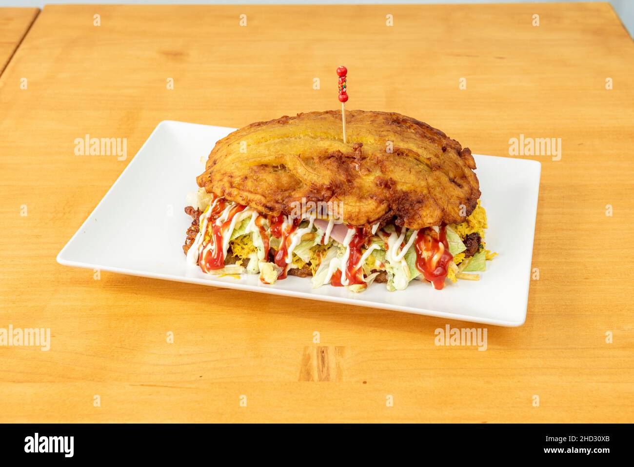 The Venezuelan patacón is flattened and fried green plantain, very ...