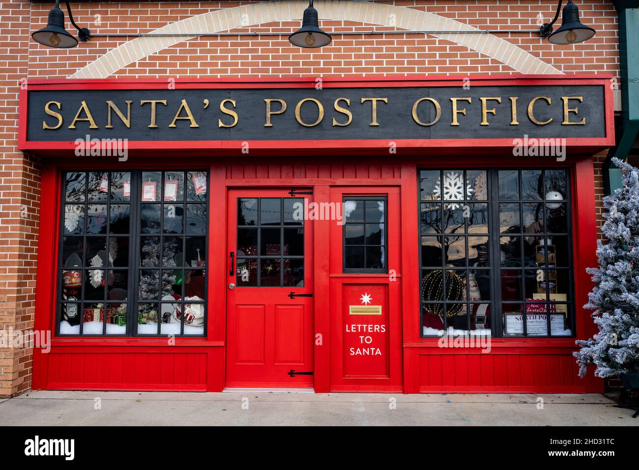 Front View of Bright Red Santa's Post Office in outdoor market Stock ...