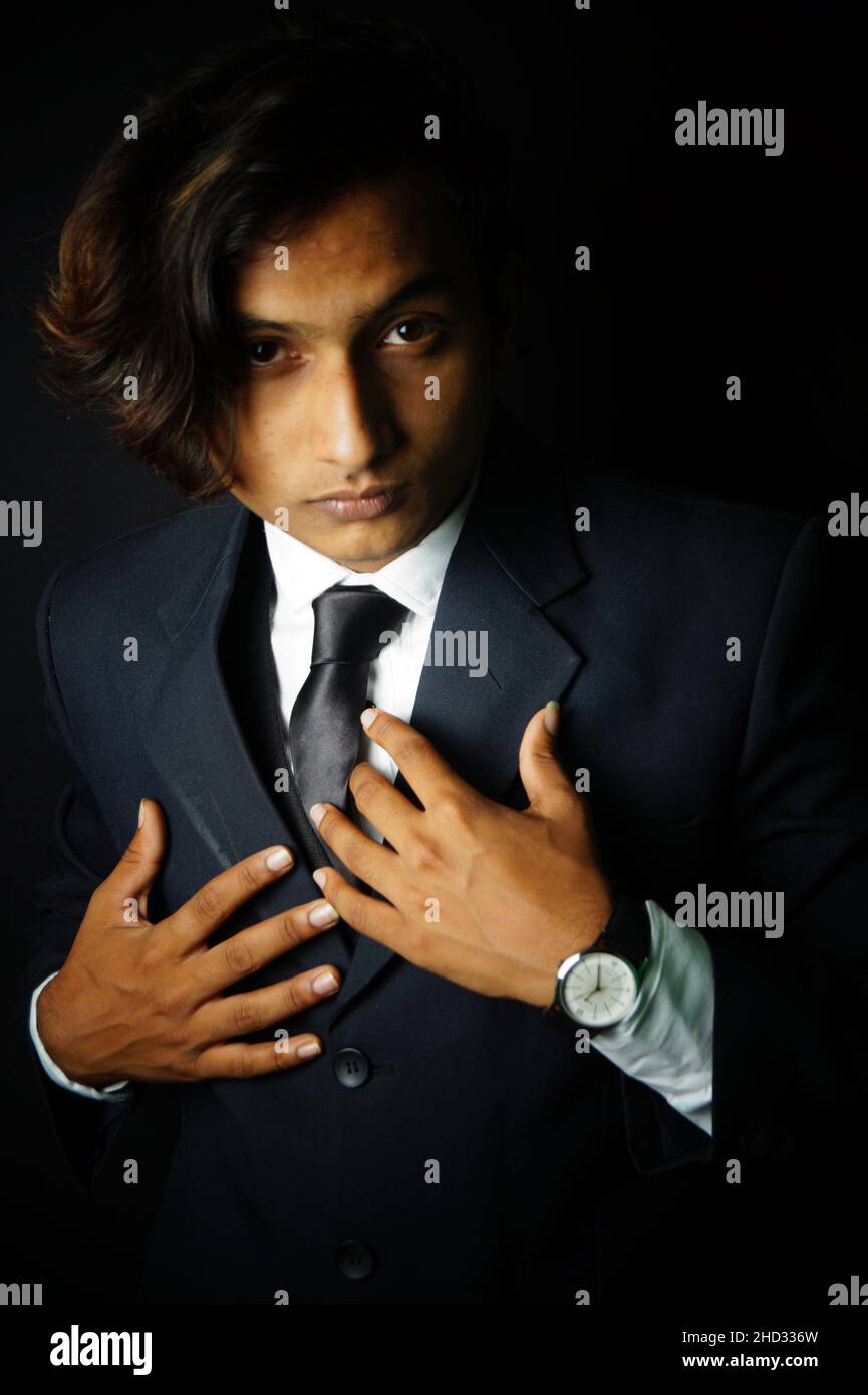 Vertical shot of an Indian man wearing a classy suit and watch Stock ...