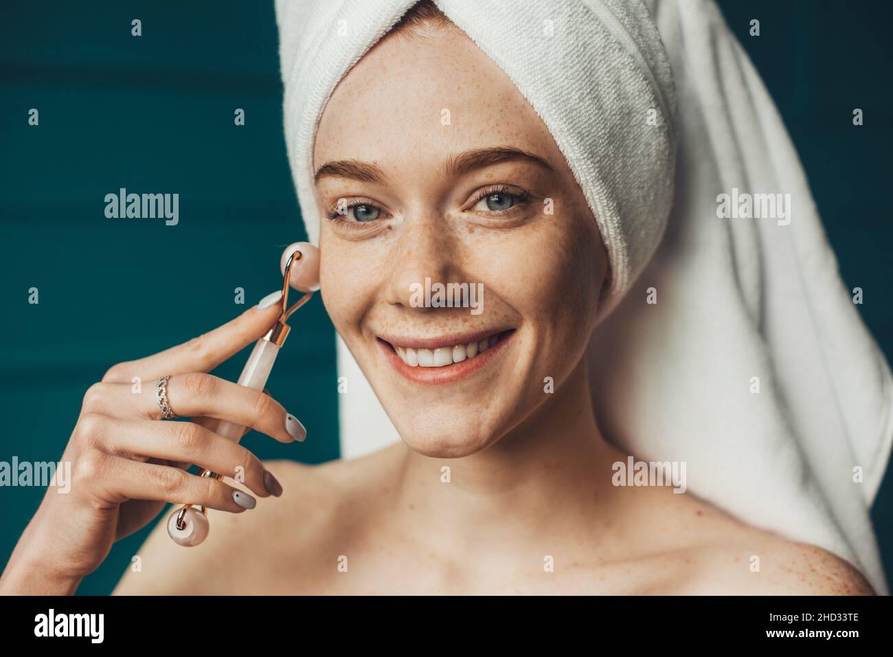 Close Up Portrait Of A Woman Getting Massage Face Using Jade Facial