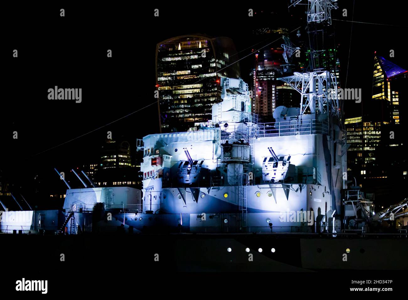 HMS Belfast at Night with Cityscape Stock Photo - Alamy
