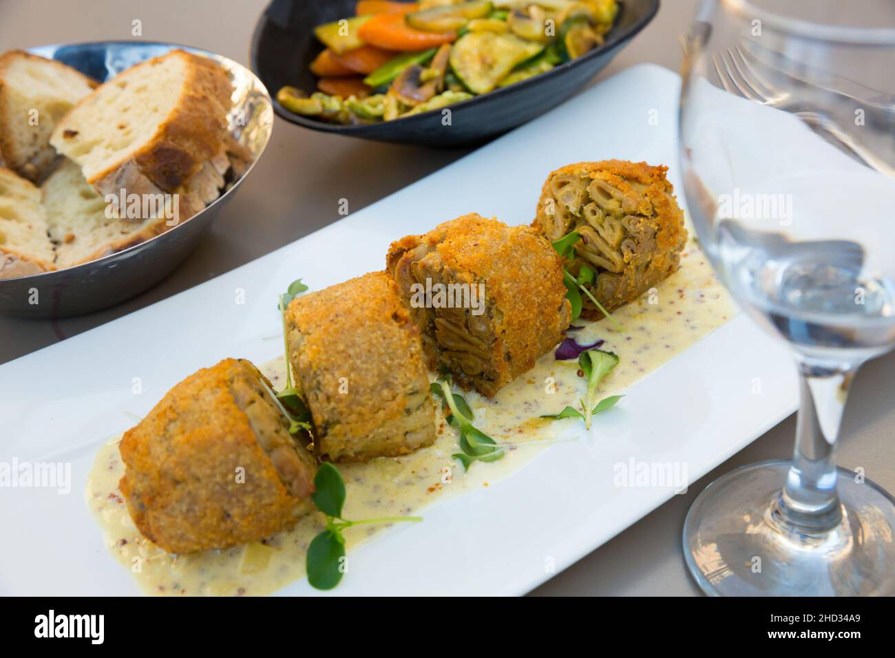 Fried roll from casings served at plate, dish of french cuisine Stock ...