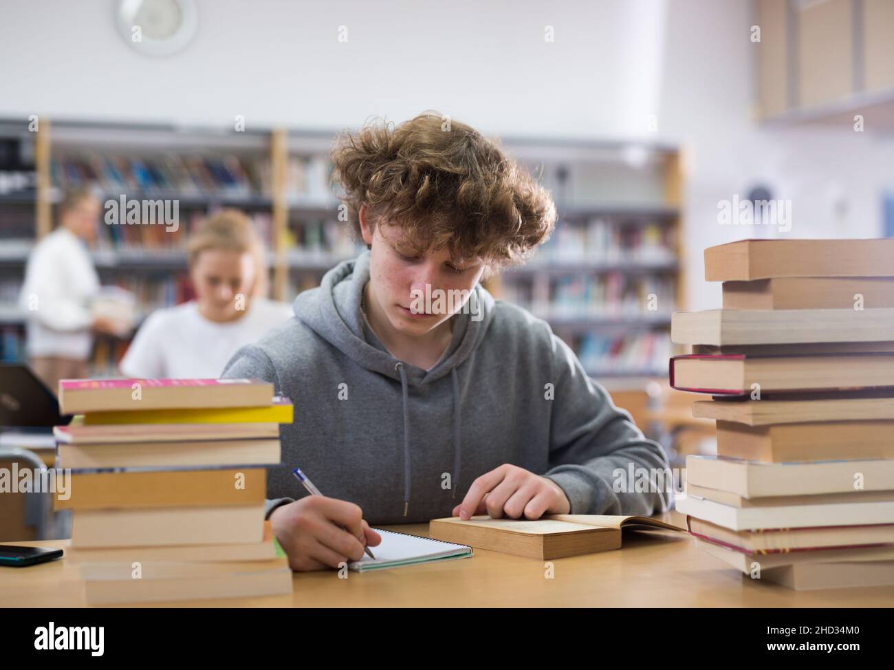 Fifteen-year-old schoolboy writes an synopsis Stock Photo - Alamy