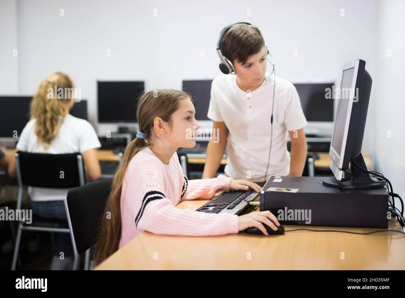 Young boy and girl in computer class Stock Photo - Alamy